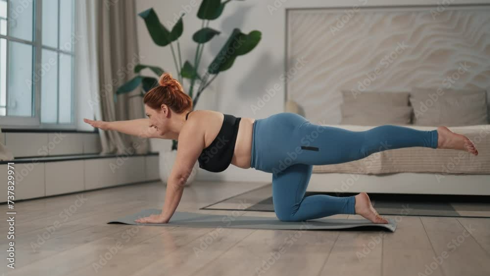 Woman training exercising at home on mat. Overweight female doing ...