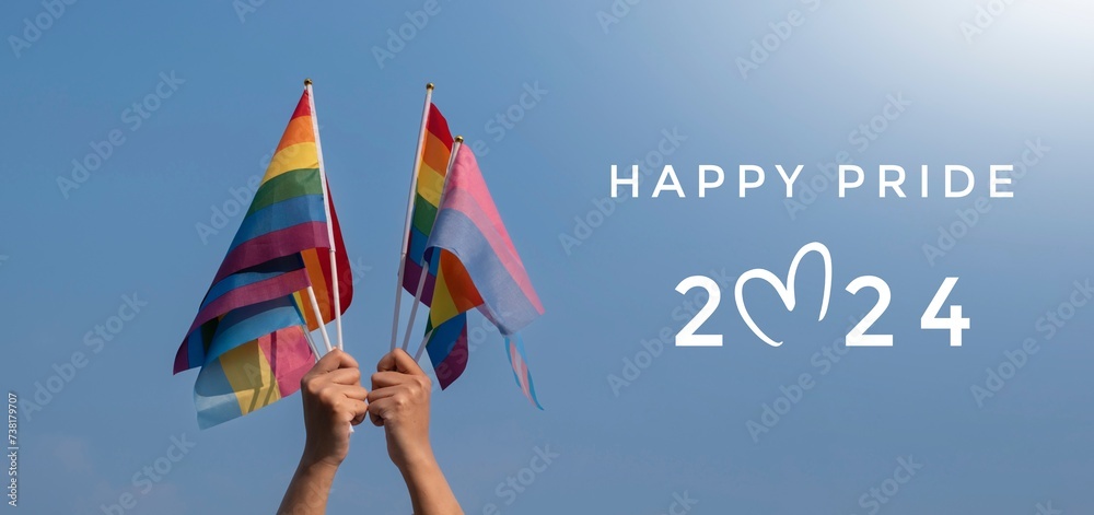 Happy Pride 2024 on rainbow flags raising background, concept for ...