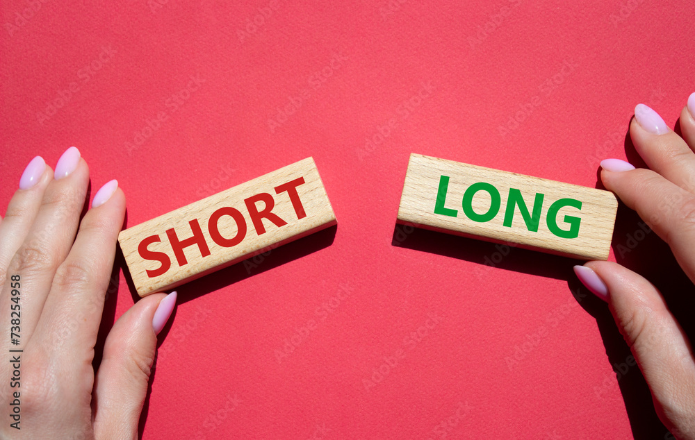 Short vs Long symbol. Concept word Short vs Long on wooden blocks ...