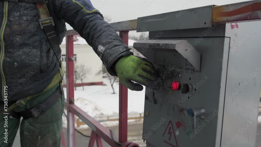 the guy at the industrial elevator control panel, the man at the cradle ...
