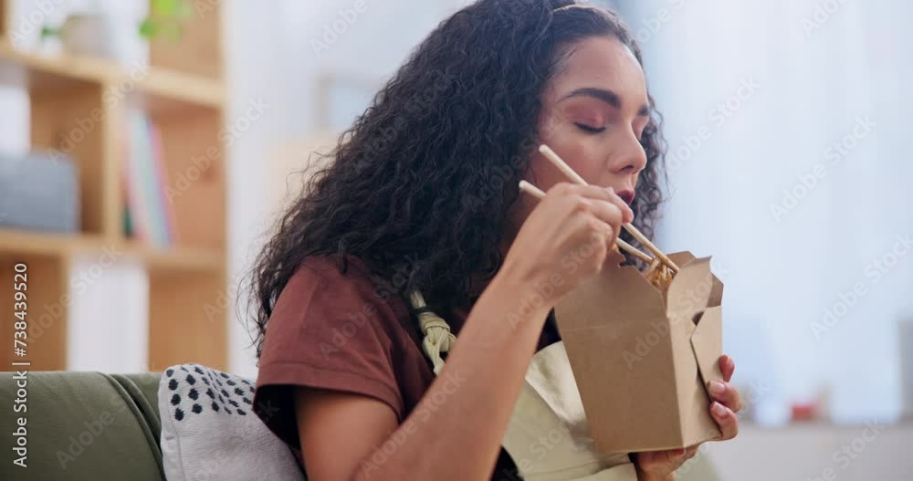 Woman, couch and eating with noodles in living room, watching tv and ...