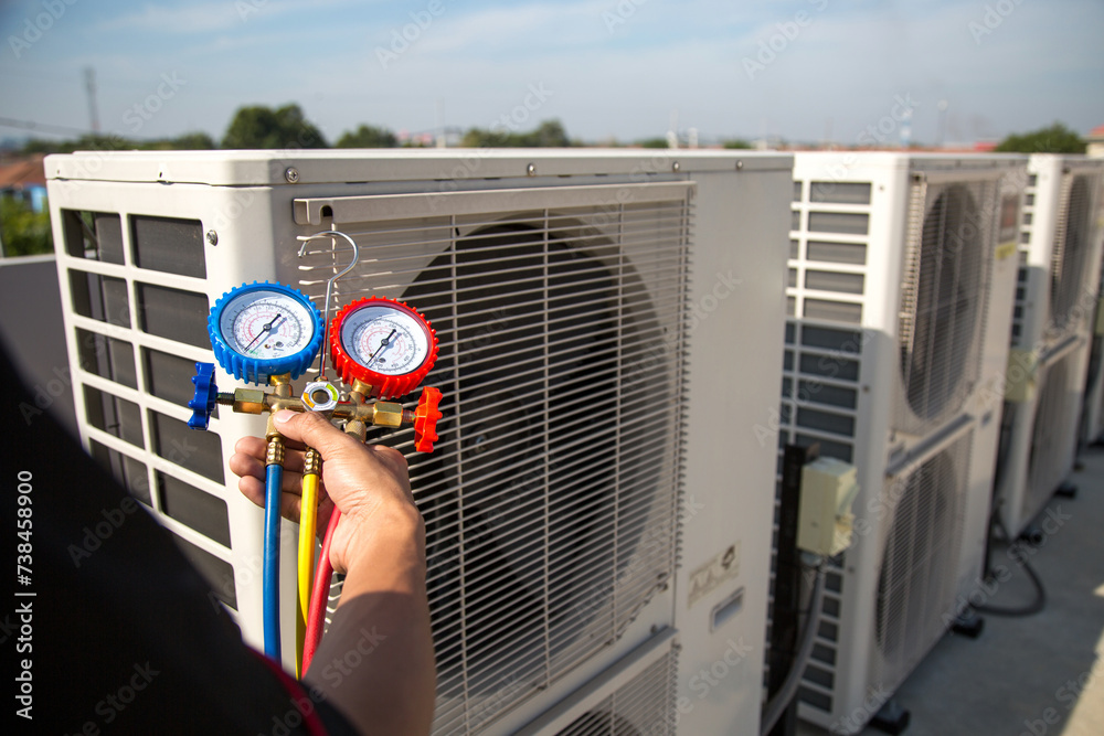 Heat and Air Conditioning, HVAC system service technician using ...