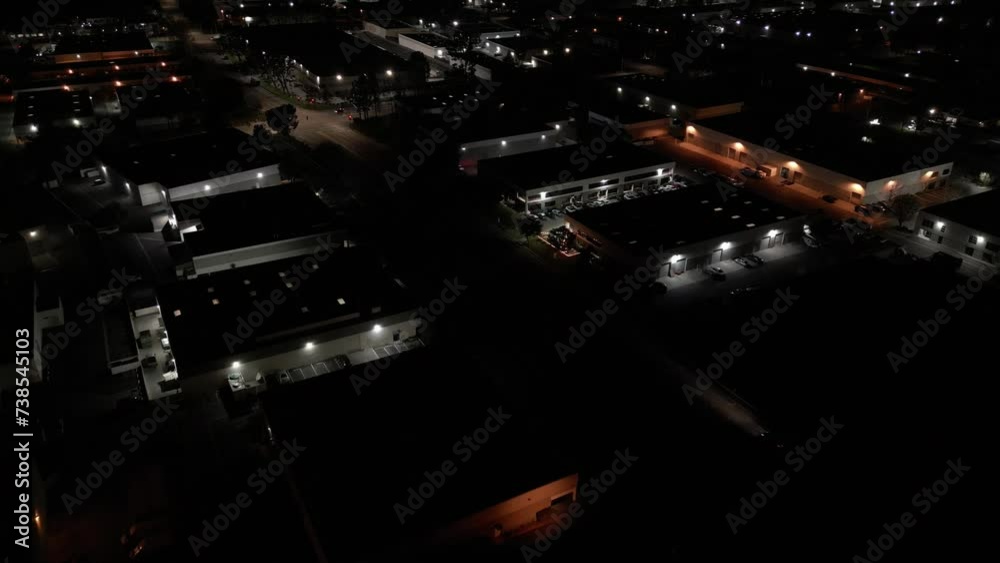 Nondescript warehouse buildings in an industrial park are shown in an ...