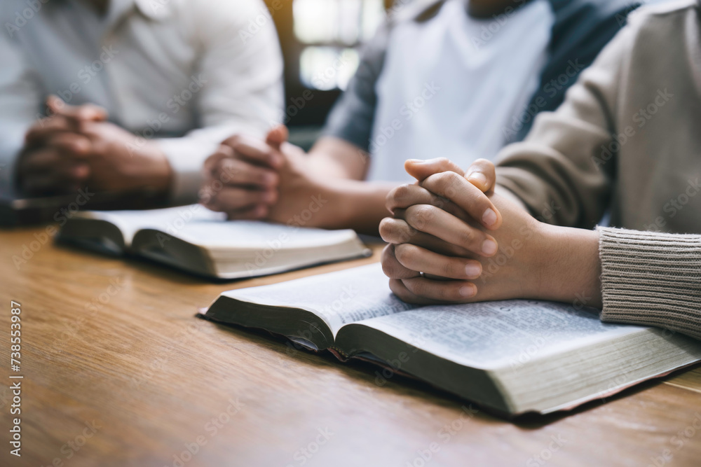 Christian and prayer. Christian group of people holding hands praying ...