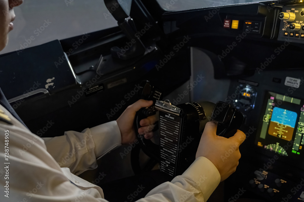 Professional captain takes helm of aircraft during flight. Man skilled ...