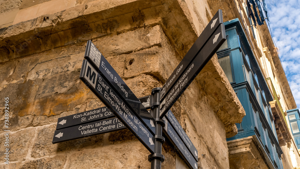 sign with street names on a limestone wall in Malta, Valleta Stock ...