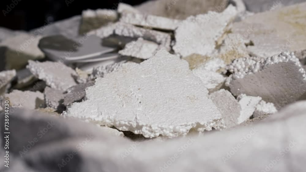 Close-up of a lot of styrofoam lying in a big bag at a waste recycling ...
