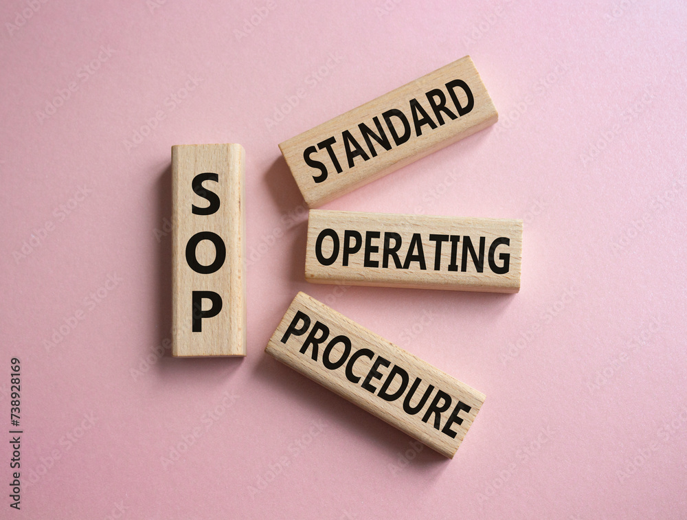 SOP - Standard Operating Procedure symbol. Wooden blocks with word SOP ...