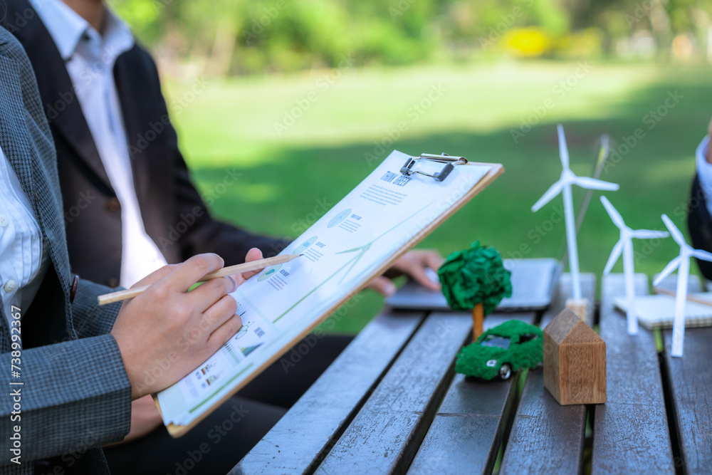 Group of asian business people presenting environmentally friendly ...