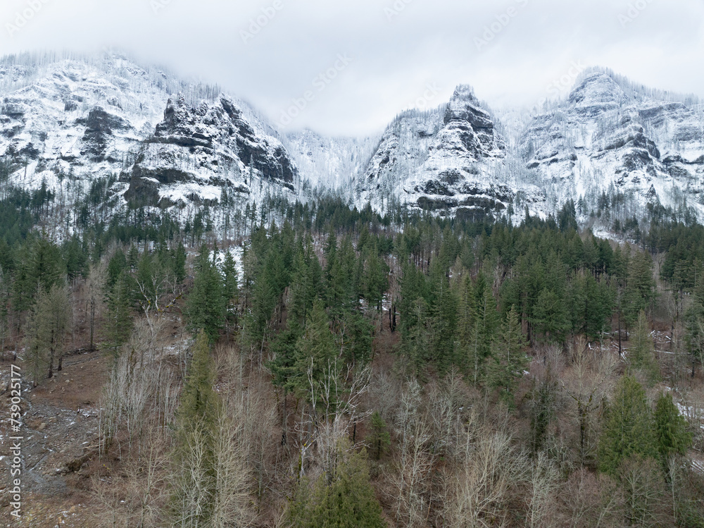 Snow covers the rugged mountain landscape in the Columbia River Gorge ...