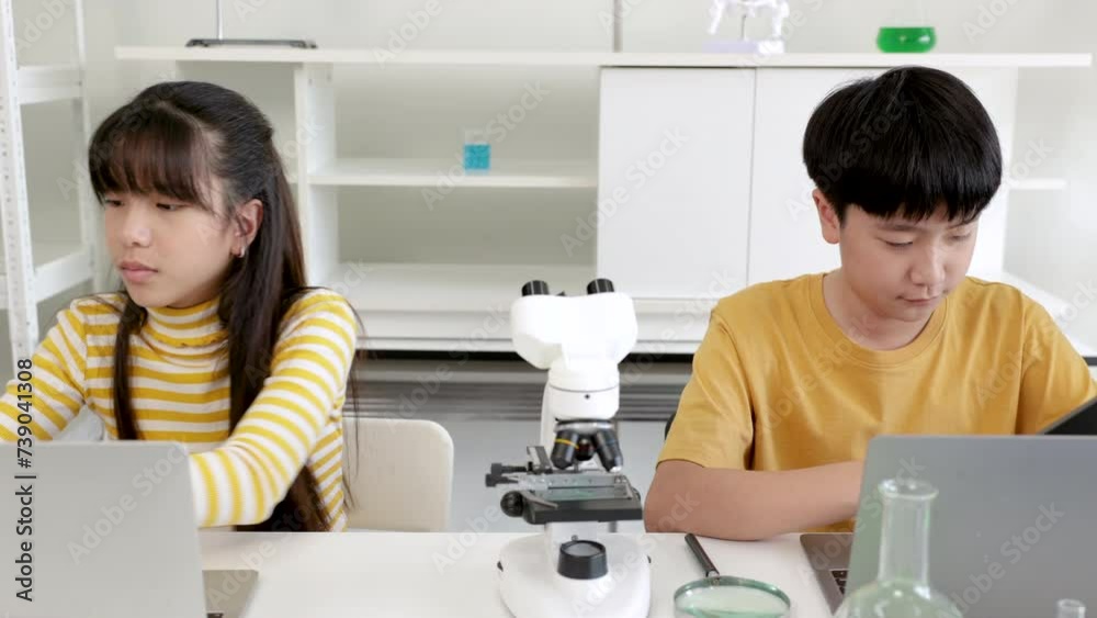 Diverse group of students happy experiments with test tubes in science ...