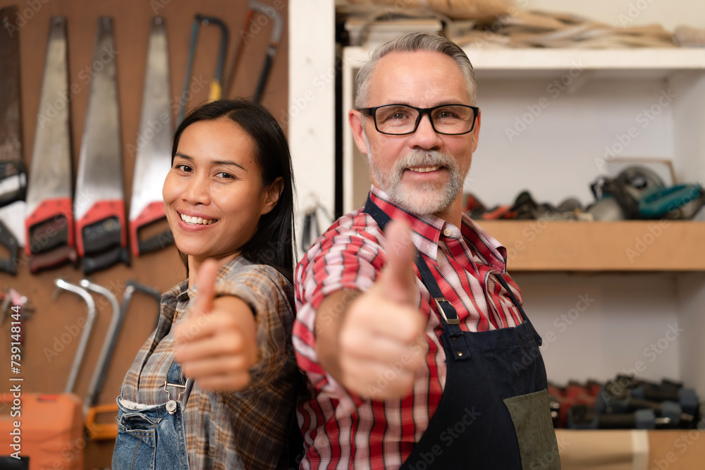Group of carpenter teamwork working at carpentry shop with tools ...
