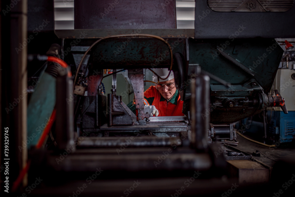 Industry engineer wearing safety uniform control operating lathe ...