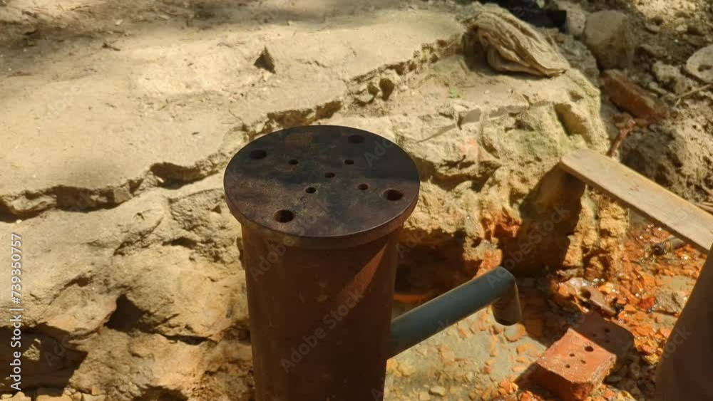 A spring water column with natural methane gas escaping through small ...