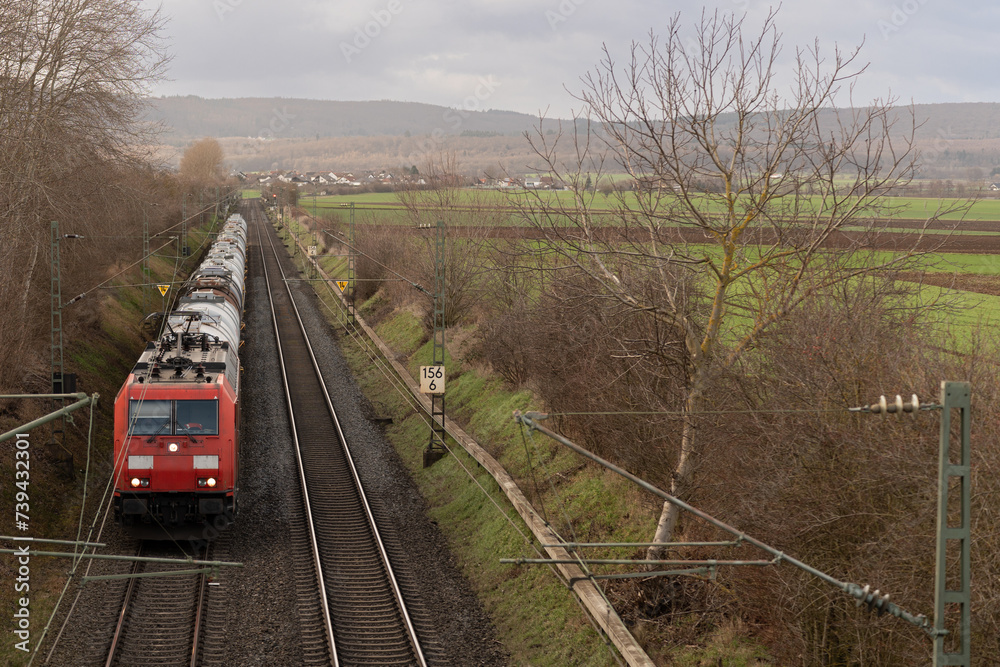 Train on the railway driving trough the countryside Stock Photo | Adobe ...