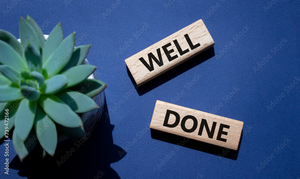Well done symbol. Wooden blocks with words Well done. Beautiful deep ...