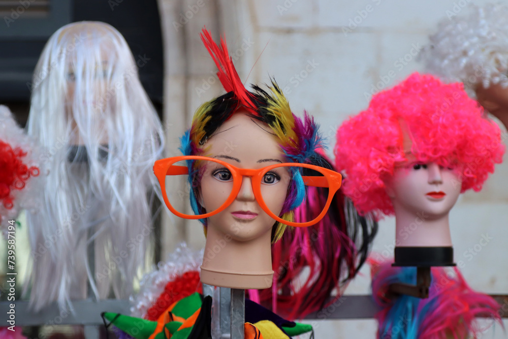 Mannequin heads with glasses, wigs and hats for carnival for sale at a ...
