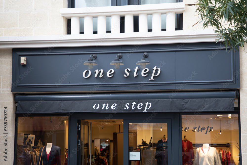 one step sign text chain and logo brand wall facade on entrance shop ...