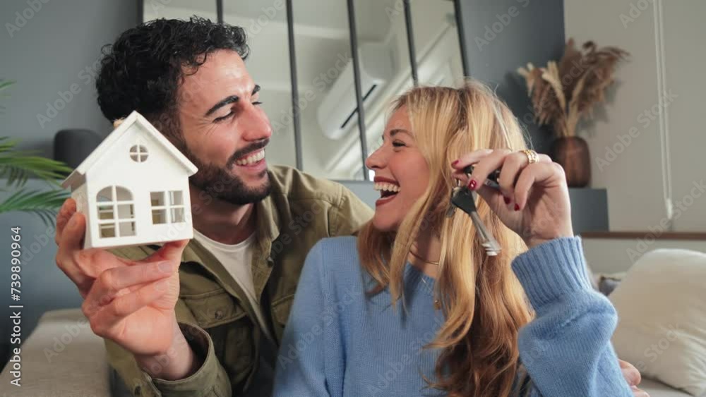 Vídeo do Stock: Husband and wife hugging in their apartment excited to ...