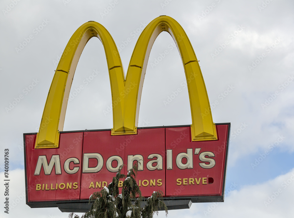 McDonald's fast food restaurant sign with golden arches and a seagull ...
