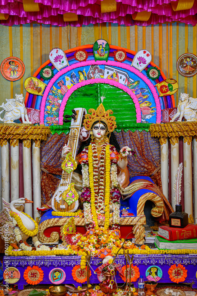 Idol of Goddess Devi Saraswati at a decorated puja pandal in Kolkata ...
