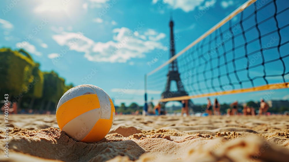 Close-up of an orange volleyball on sandy court in Paris, with Eiffel ...