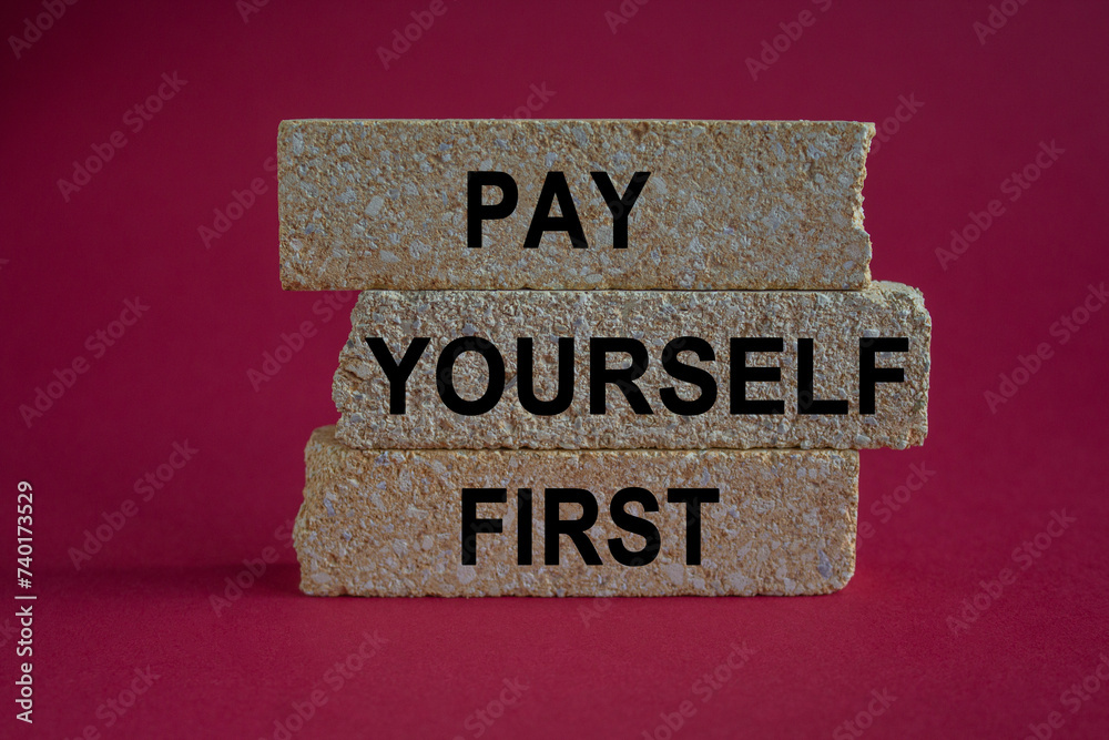 Concept words Pay yourself first on beautiful brick blocks. Beautiful ...