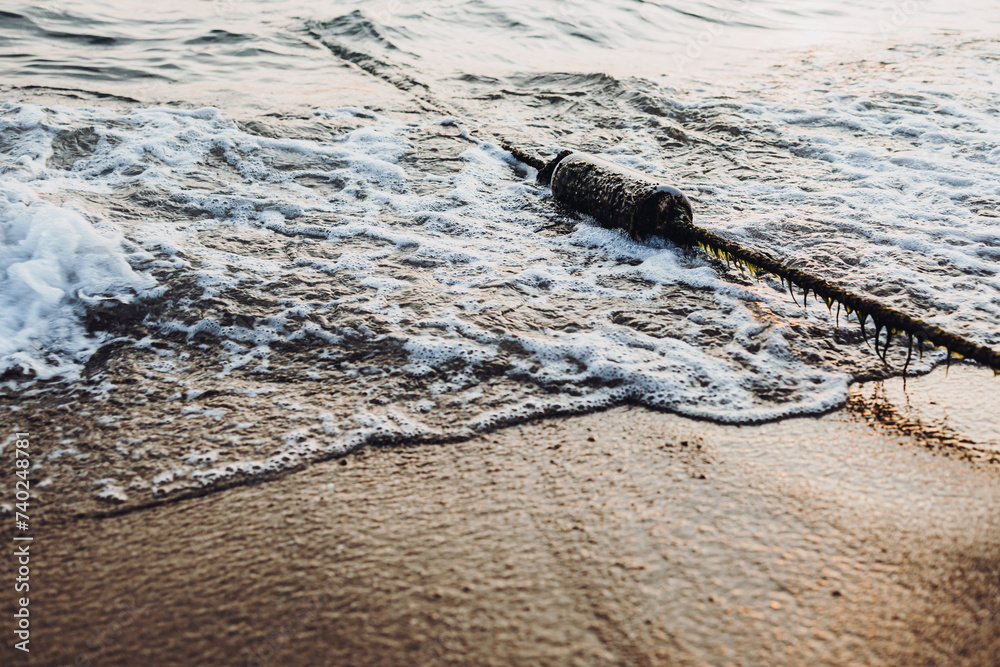 sea buoy. rope with buoy on the beach. precautionary measure on the sea ...