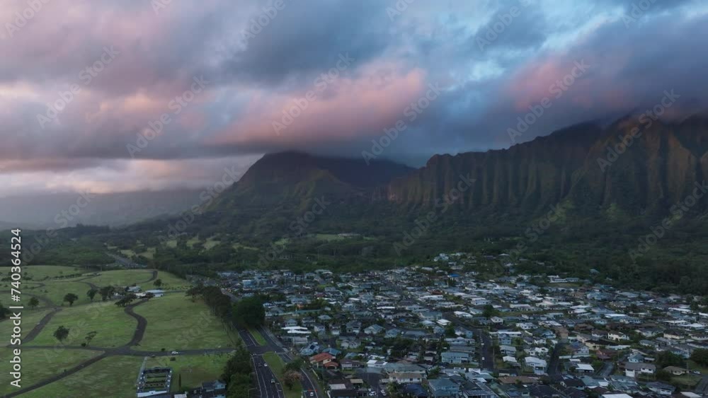 Aerial view of Kaneohe small town on Oahu island. Scenic mountain ridge ...