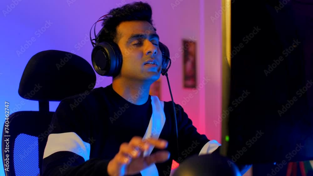 An upset young Indian man playing an esports tournament - feeling sad ...