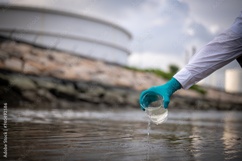 Scientist factory wearing protective uniform and glove under working ...