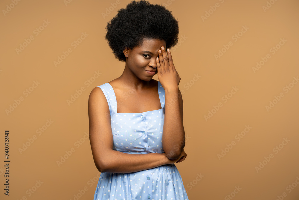 Shy calm bashful african female with natural curly hair, wearing blue ...