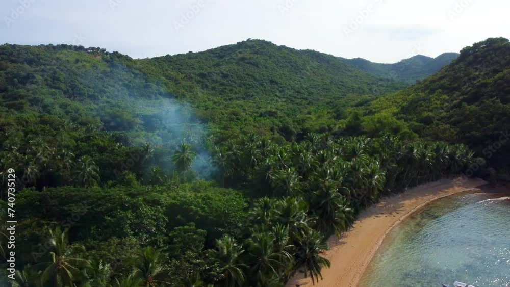 Aerial low pass 4k cinematic view of fishing boats and shores of Ocam ...