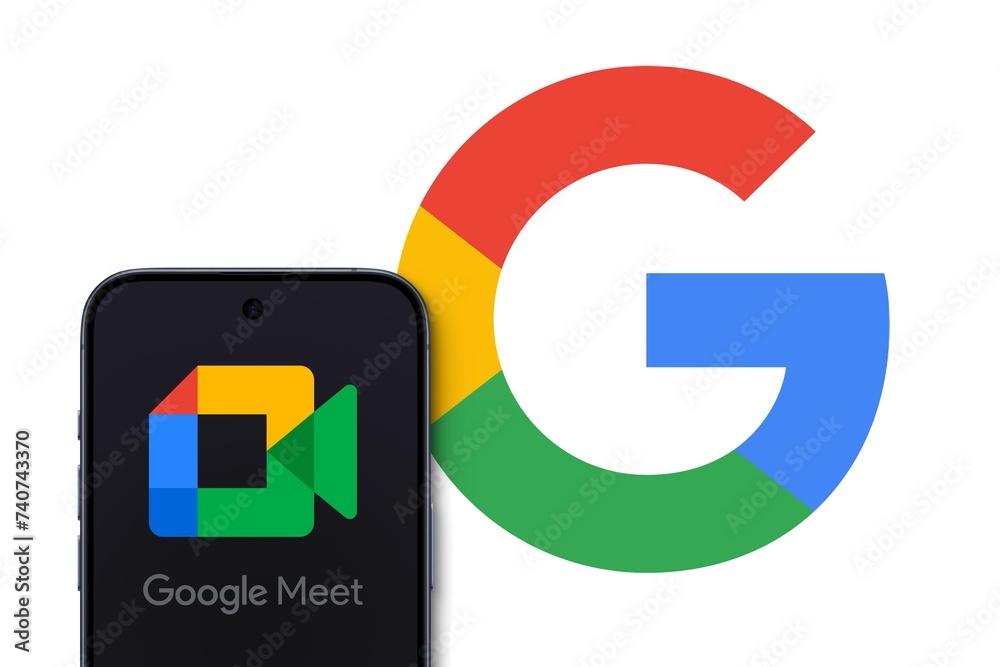 Google Meet logo is displayed on a modern smartphone, big Google logo ...