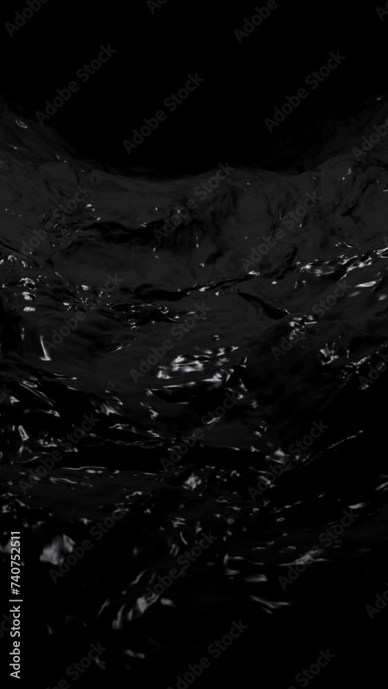 Vertical video - a rippling stream of black crude oil flowing towards ...