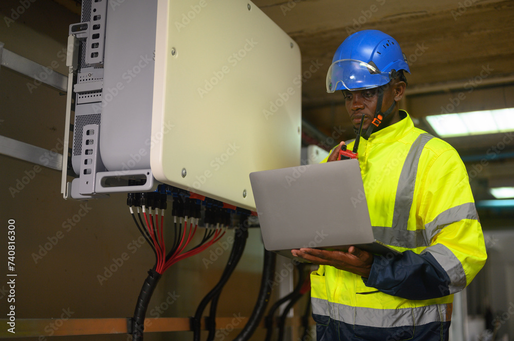 engineering technician Setting up the solar panel inverter in the ...