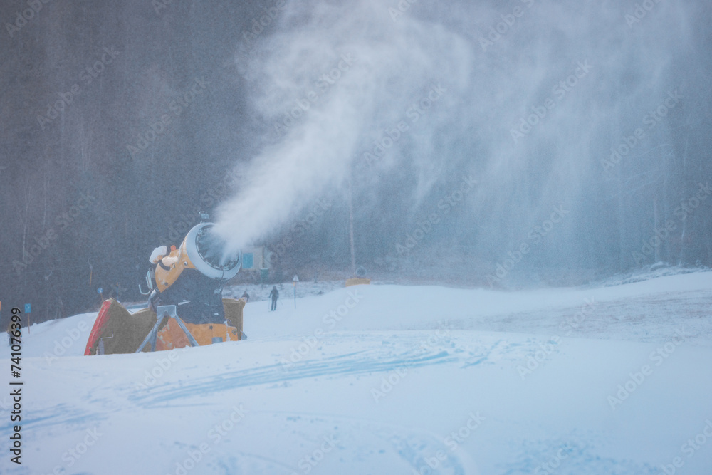 Artificial snow generator osr snow cannon in action on a ski slope ...