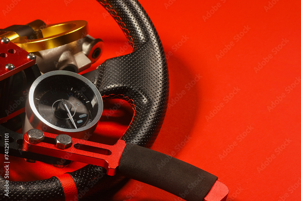 Sport car tuning equipment and spare parts on red top view background ...