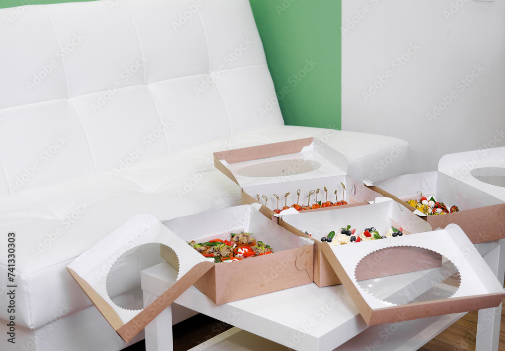 Office Celebration with Gourmet Catering Snack Boxes.In a minimalist ...
