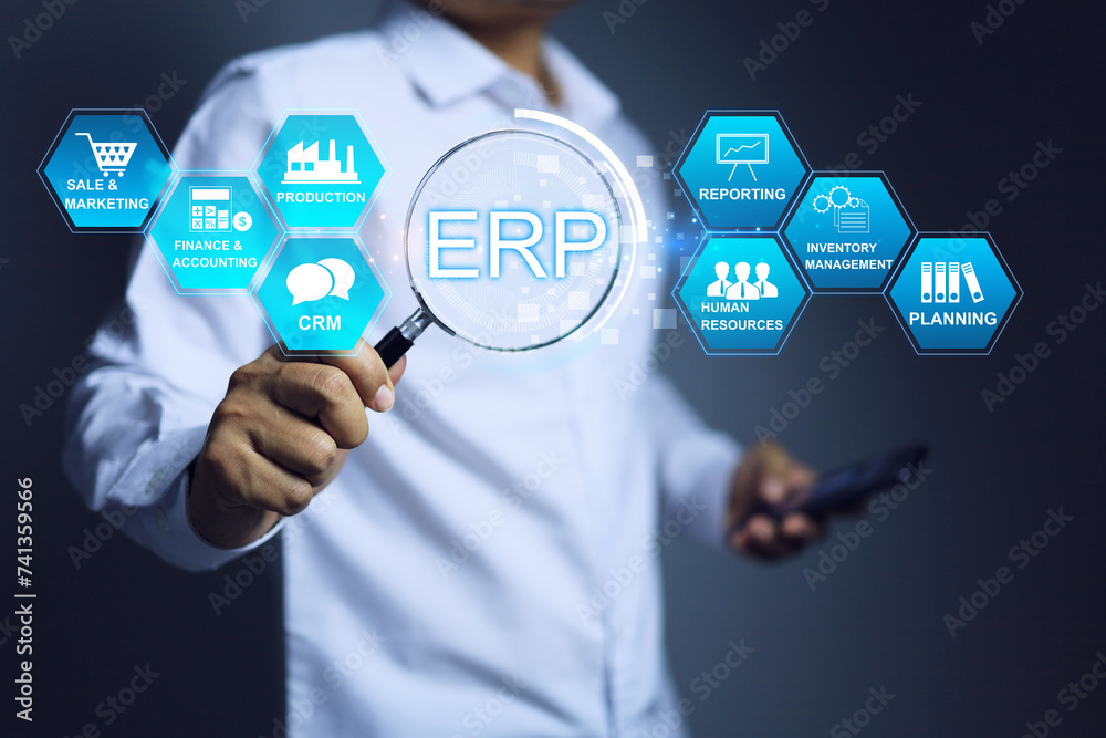 ERP Enterprise Resource Planning concept with businessman hold magnifying glass providing ...