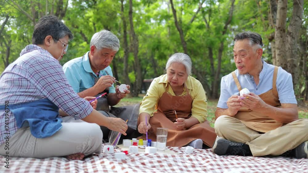 Art activities for the elderly. A group of elderly people sit and paint ...