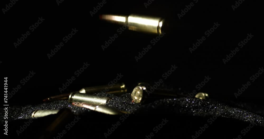 Red-tipped 6mm ARC Bullets Drop Into Bullet Grains, Isolated In Black ...