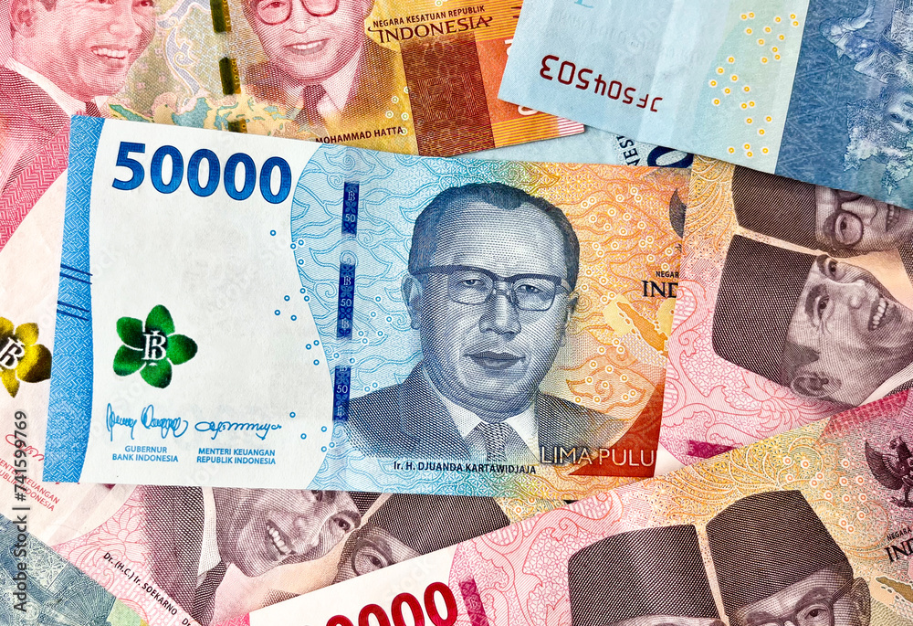 Red and blue colored five thousand and one hundred thousand Indonesian ...