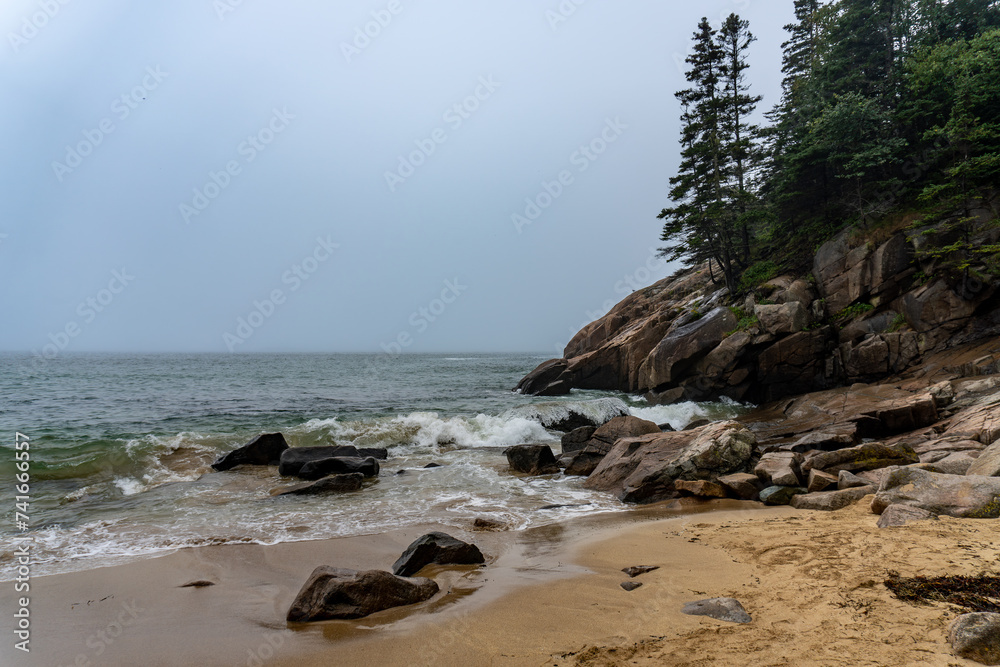 Crashing waves on Sand Beach in Acadia National Park, Maine. Surrounded ...
