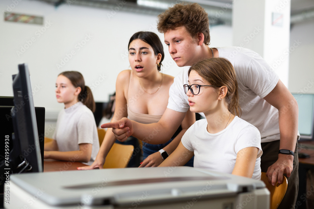 Teenage boys and girls using computers in IT room Stock Photo | Adobe Stock
