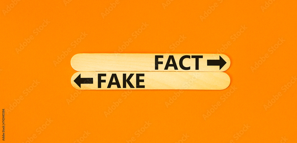 Fact or fake symbol. Concept word Fake and Fact on beautiful wooden ...
