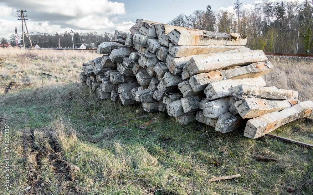 a stack of stored railway sleepers ready for installation on a newly ...
