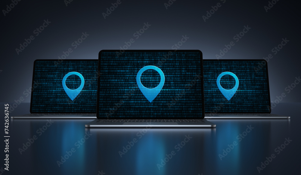 Laptop devices with Location pin icon on their screens on a dark ...