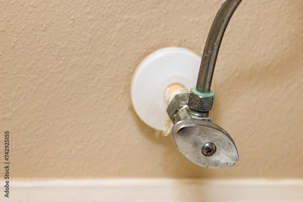 Residential home bathroom toilet water shut off valve. Replacing old ...