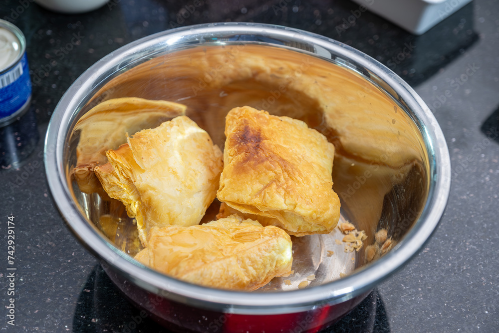 um ali is arabic sweet that made of puff pastry and nuts with milk and ...